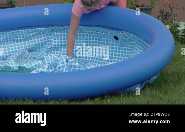 Cleaning pvc inflatable swimming pool, Cleaning the dirty empty pool of ...
