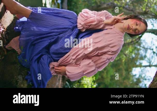 Charming woman relaxing near lake beautiful wild forest. Dreamy sensual girl nymph sitting under ...