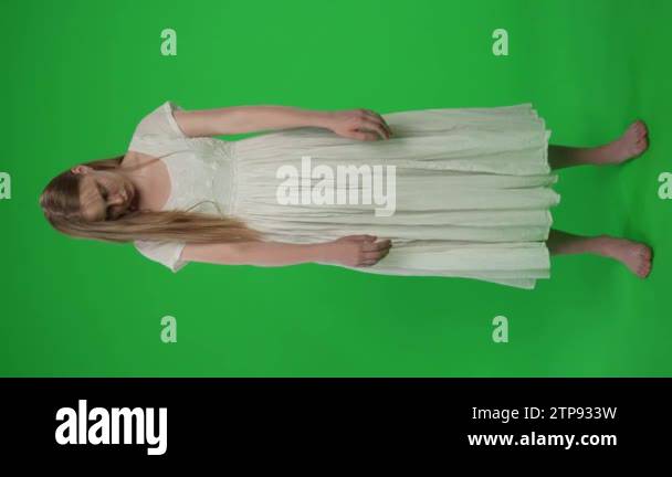 Full-size vertical green screen, chroma key video of a posessed female ...