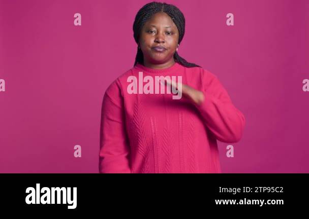 Expressive young black woman showing time-out sign using her hands in ...