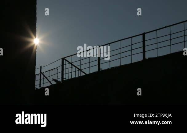 Background. Metal fence on the back of the sun. Camera movement. Sun ...