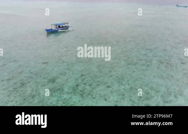 Soar above Pulau Tabuhan, Banyuwangi, and marvel at its white-sand ...
