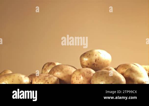 Potatoes fly up and fall down. Filmed on a high-speed camera at 1000 ...