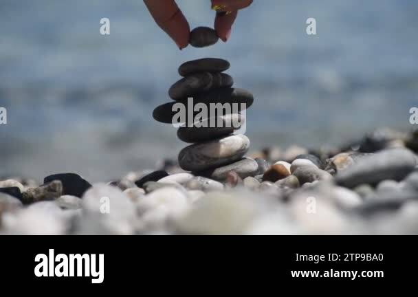 Hand building stone tower Stock Videos & Footage - HD and 4K Video ...