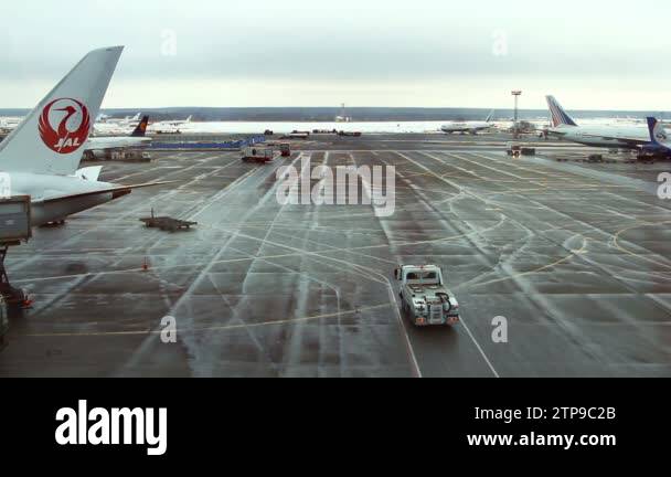 Airport traffic: landing airplanes, waiting for takeoff permission ...