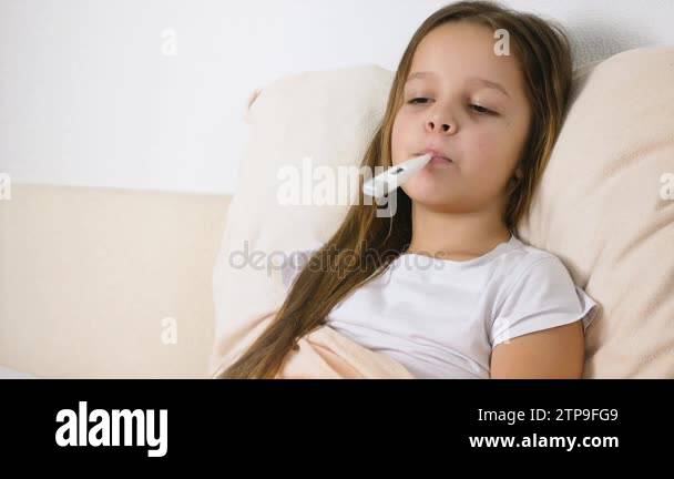 Mom is measure the temperature of little girl Stock Video Footage - Alamy