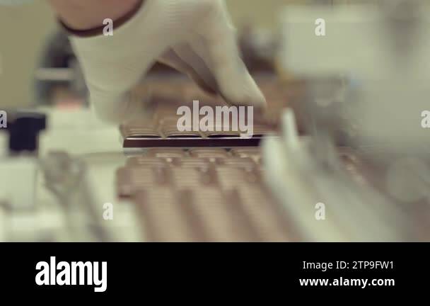 static slow motion close up shot of employee with white gloves ...