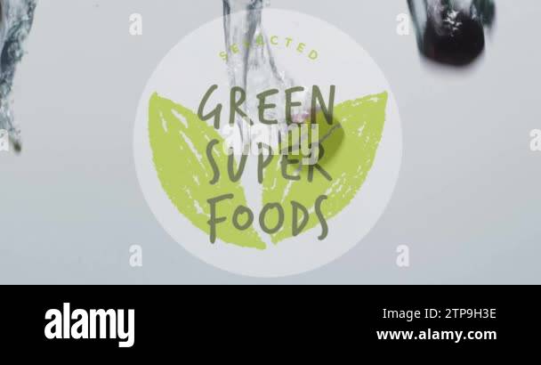 Animation of green super foods text on circle on fruit falling into ...