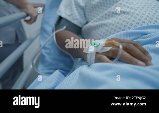 Medic pushes African American man on gurney to operating room down ...