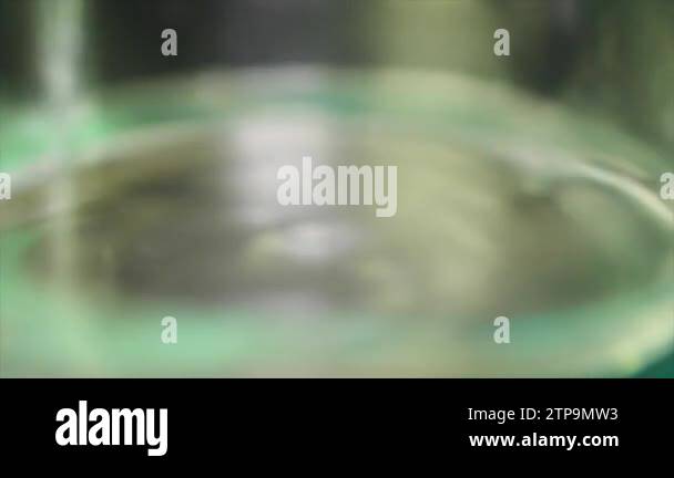 Pouring hot black tea from restaurant style cattle. Boiling water is ...