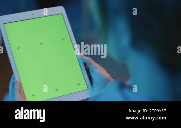 Panning left close up of unrecognizable woman with tablet in hands and ...