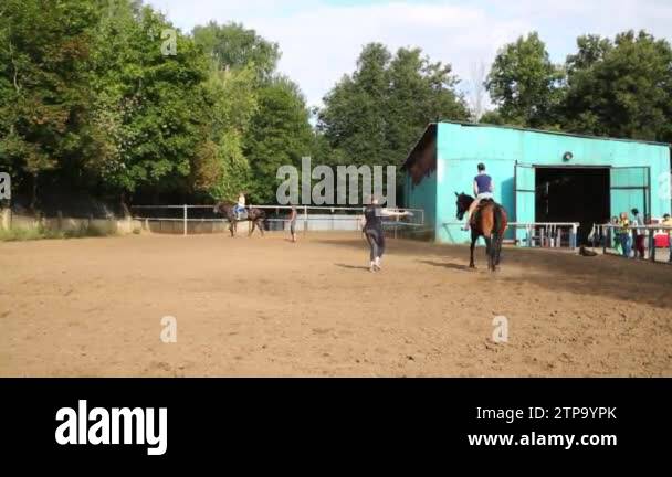 Paddock for horse training and people look at riding woman Stock Video ...