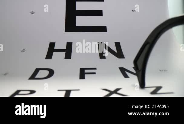 Glasses on paper Snellen chart to measure visual acuity. Medical ...