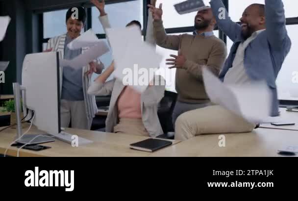 Business people, throw paper and applause with high five to celebrate by computer in corporate ...