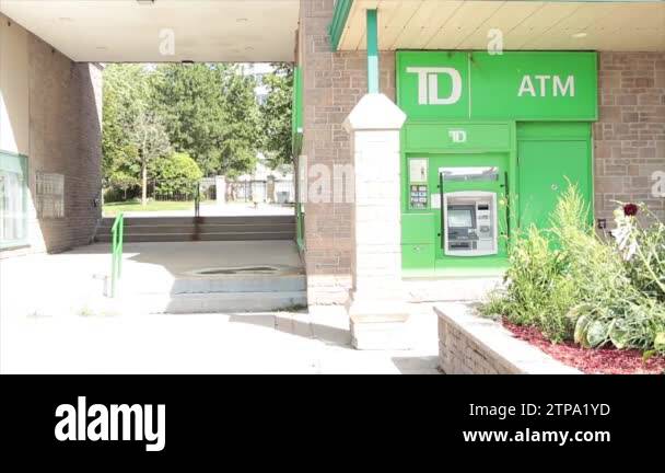 td toronto dominion green bank machine atm under facade roof ceiling ...