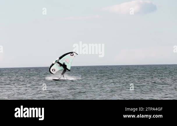 Modern water sport. Hydrofoil ride on the ocean using the wing and the ...