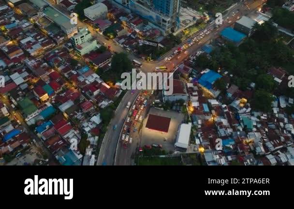 Flying over the busy highway at night in Davao City Mindanao ...
