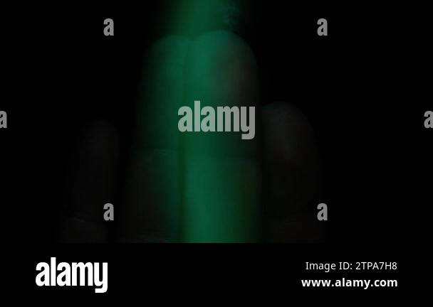 A man touches his hand to electricity. Aura scan, human electromagnetic ...