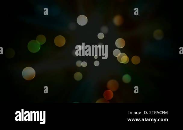 abstract colorful transparent circles appear in the center on a dark ...