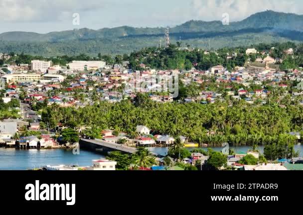 Surigao City with commercial buildings and stilt houses. Mindanao ...