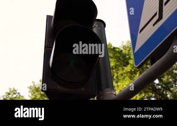 Close-up of traffic light at intersection of large city,regulating ...