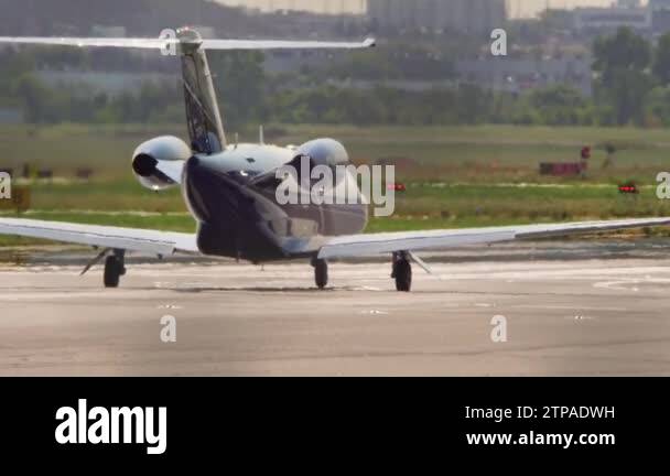 Close up of a small two engines jet airplane in shimmer haze prepare ...