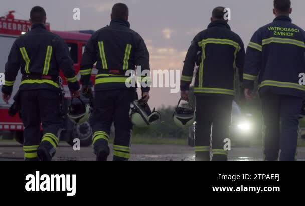 Brave Firefighters Team Walking after finished. Paramedics and Firemen ...