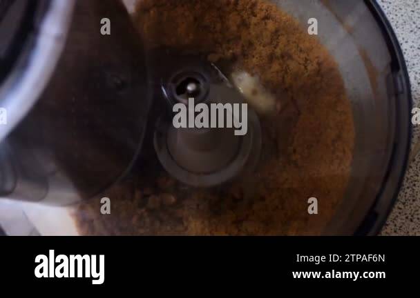 blender crushes crumbled biscuits with the addition of cocoa powder for ...