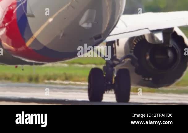 Close up at working engine jet of the airplane before taking off at hot ...