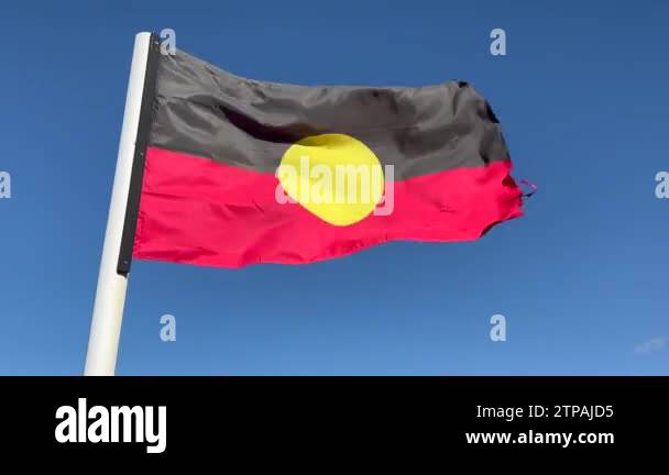 The Australian aboriginal flag of Australia first nation people waving ...