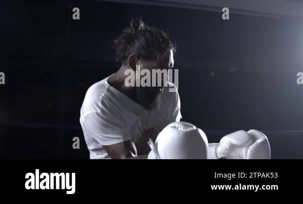 Speed-Ramped Showdown - Muay Thai Fighter Delivers Kick in Boxing Ring ...