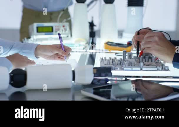 4K Technical design team collaborating on construction of robot in ...