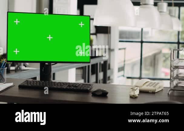 Workstation desk with greenscreen monitor in business agency office ...
