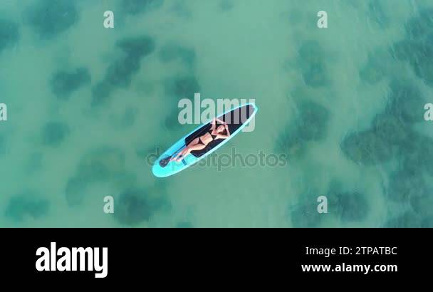 Static footae of Attractive woman in bikini is sunbathing on a ...