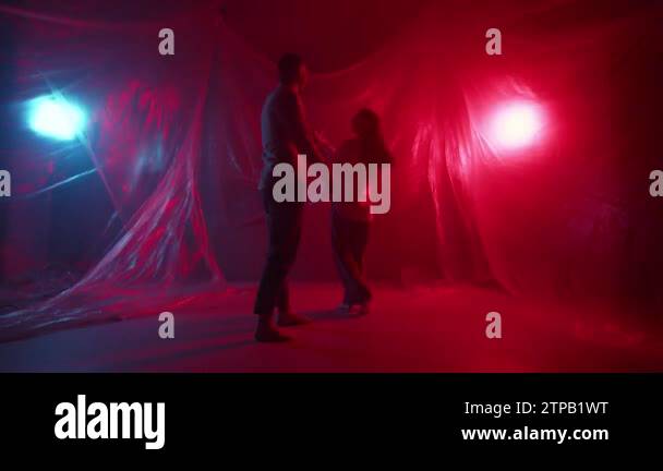 Sensual man and woman. Dancing couple on neon light background. Young ...