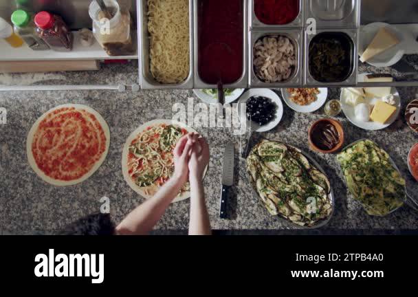 Top view process of preparation pizza with various vegetables on marble ...