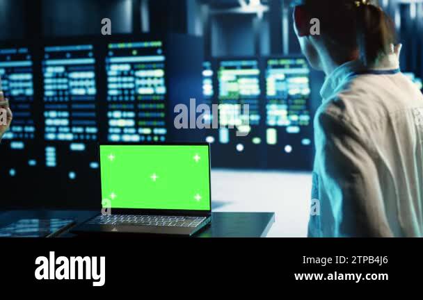 Engineering coworkers using mockup laptop to implement artificial intelligence parallel ...