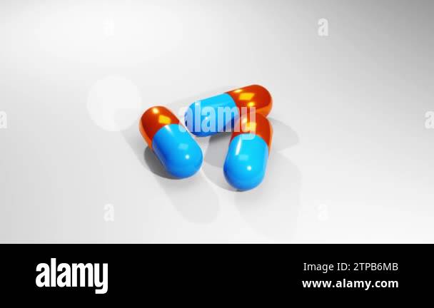 Three tablets lie on a white surface with a gray background. The ...