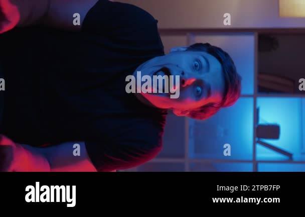 Vertical video. Grimacing man. Meme expression. Silly behavior. Foolish ...