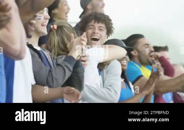 4K Excited sports fans at live event clapping and cheering for their ...