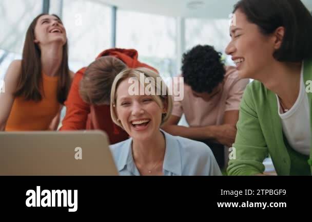 Startup agency team laughing at laptop workplace closeup. Happy group ...