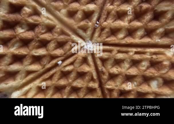 Homemade waffle with waffle iron mold in the kitchen with sugar, 4k ...