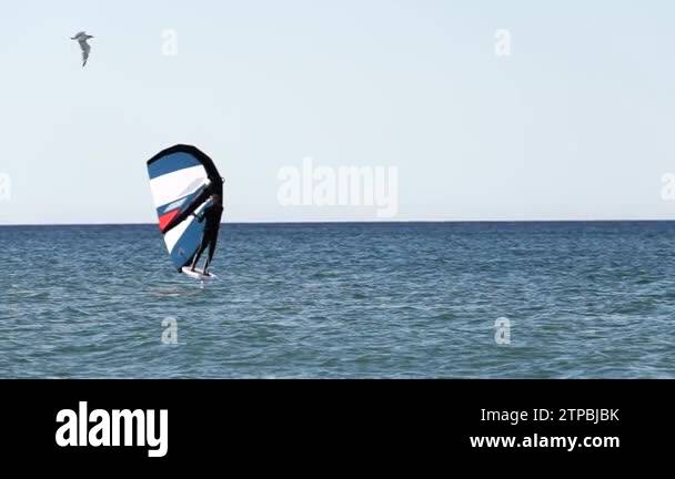 Modern water sport. Hydrofoil ride on the ocean using the wing and the ...