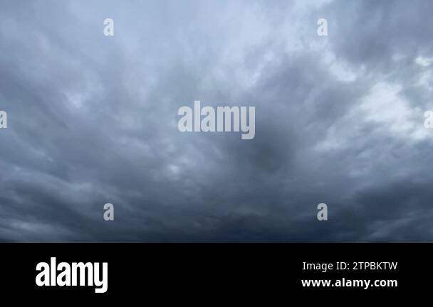 Cloud time lapse background. Cumulus dark storm grey cloud moving on sky. Nature, weather ...