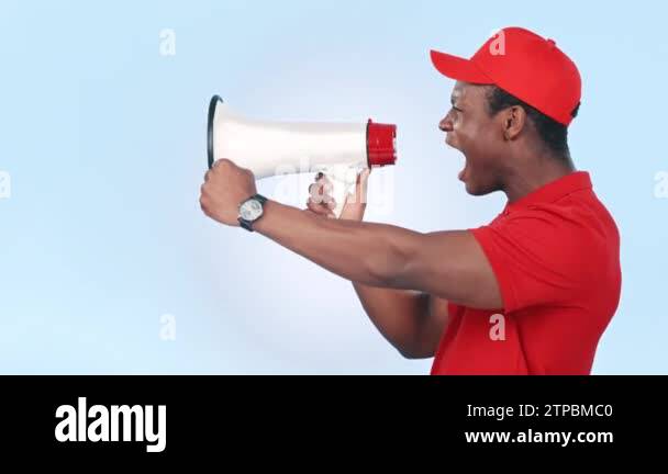 Megaphone, shouting and young black man in a studio for announcement or ...
