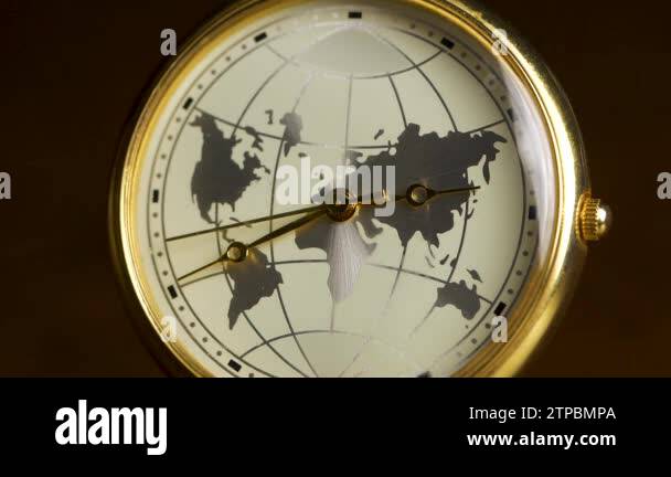 Clock with a picture of planet earth. A concept work of the world with ...