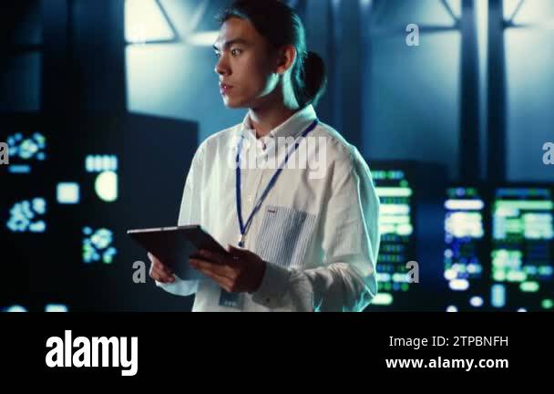 Proactive Employee Walking Through Data Center Electronics Providing Processing Resources For