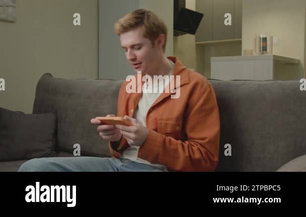 White Man Loosing Video Game on Smartphone. Upset man lost cell phone ...