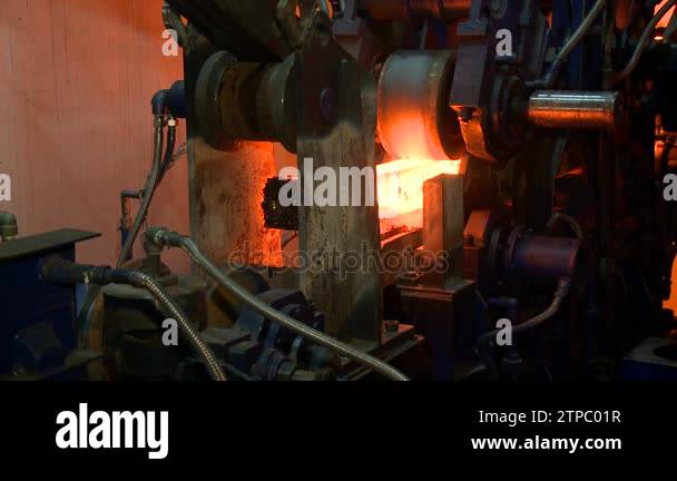 Hot steel ingots on conveyor. Foundry casting process, black metallurgy ...