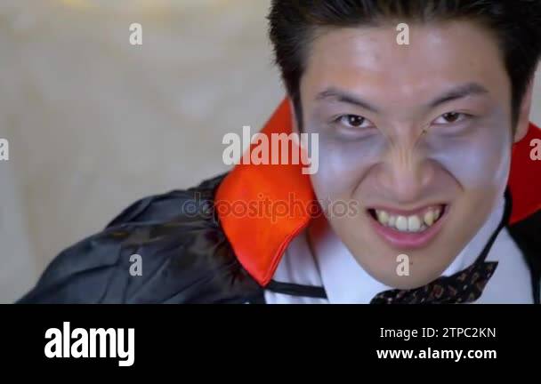 Japanese man as Dracula making a scary face Stock Video Footage - Alamy